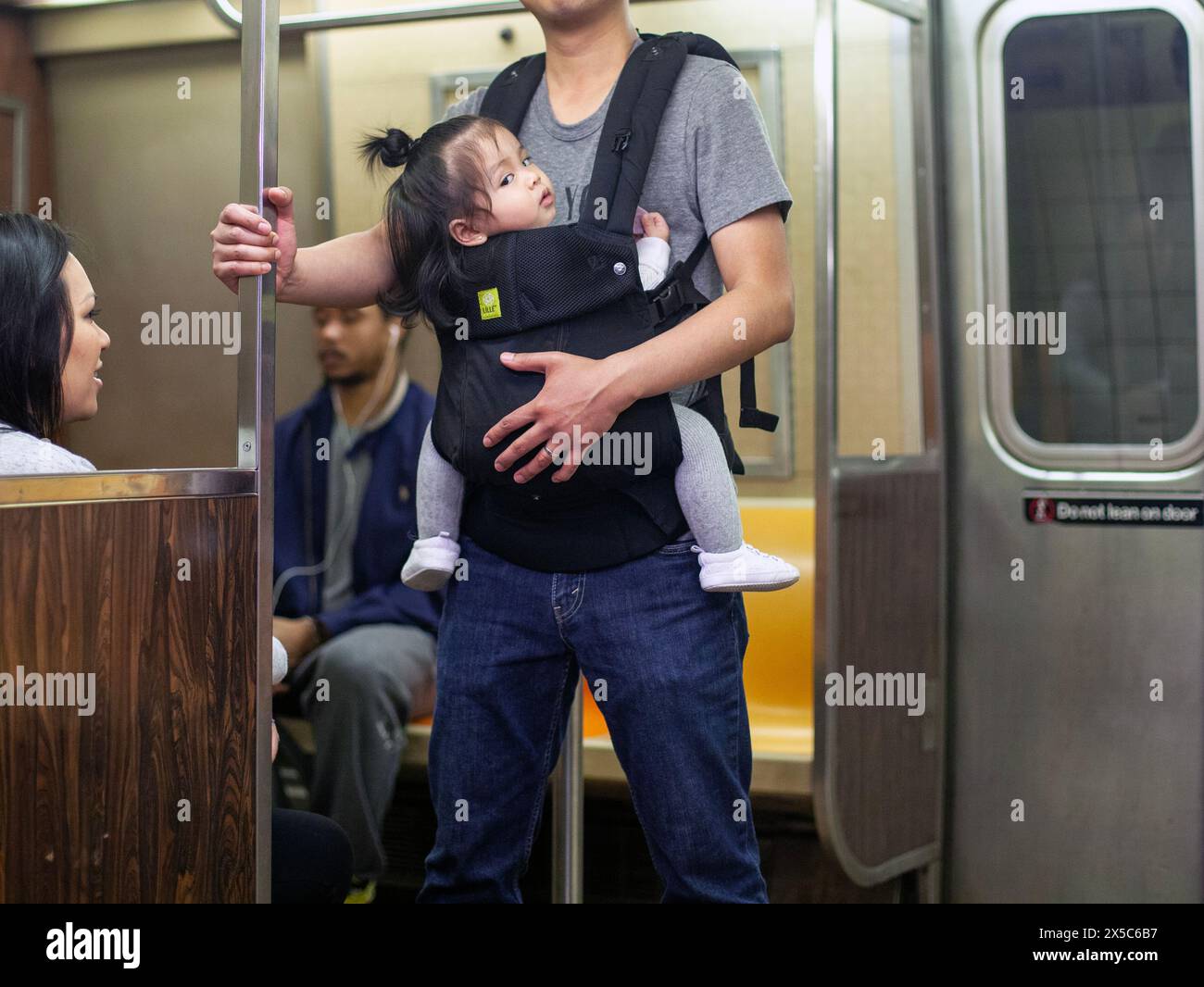 Man carries his daughter hi-res stock photography and images - Alamy