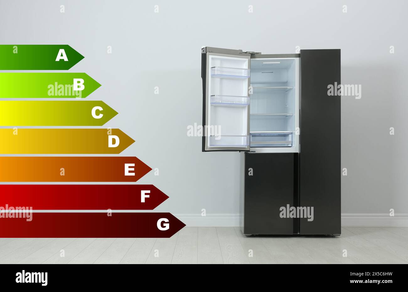 Energy efficiency rating label and open refrigerator indoors Stock ...