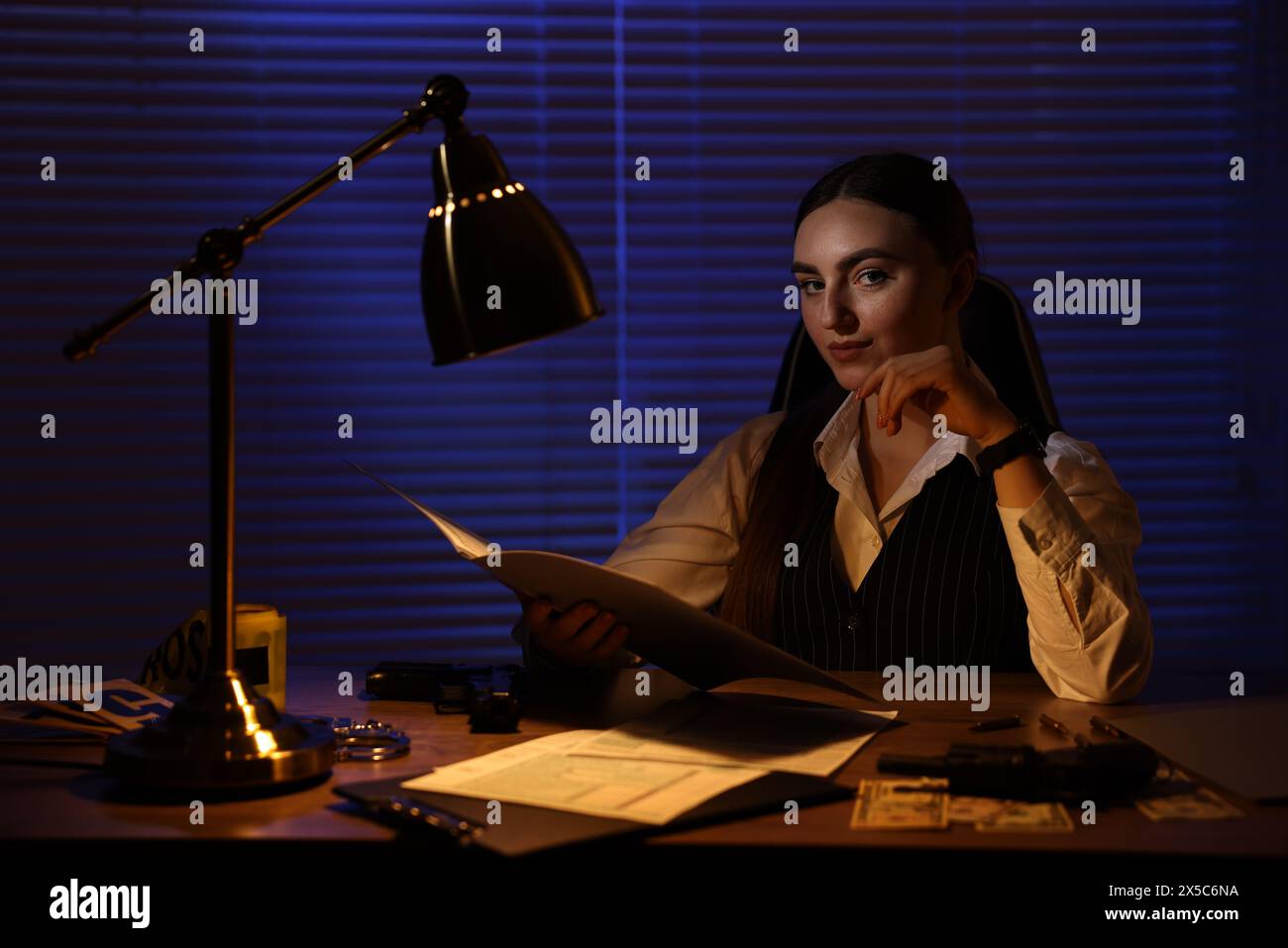 Professional detective working documents hi-res stock photography and ...