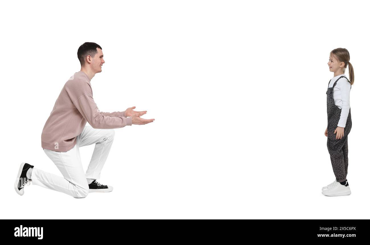 Father reaching for his daughter on white background Stock Photo - Alamy