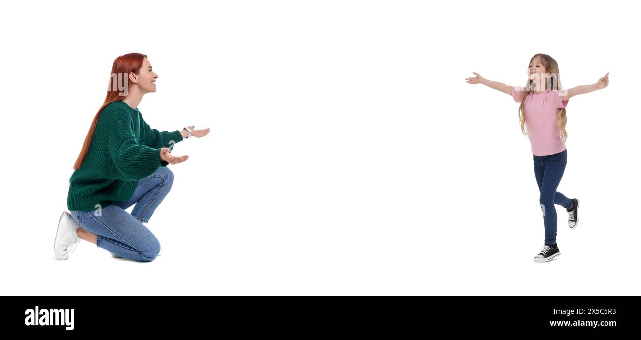 Happy girl running towards her mother on white background Stock Photo ...