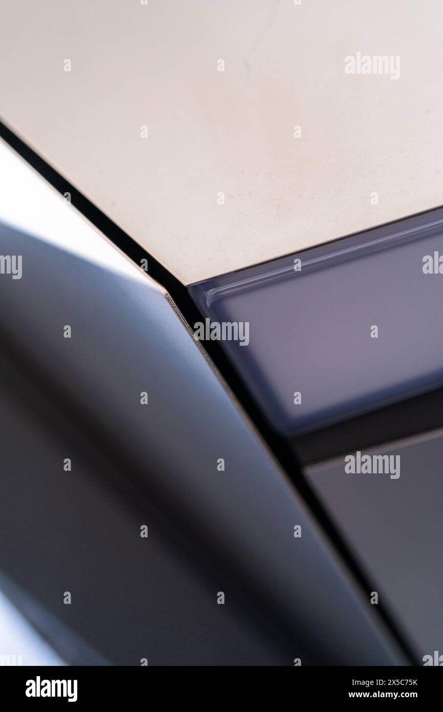 Close-Up View of the Tesla Cybertruck Side Panel and Tire Stock Photo ...