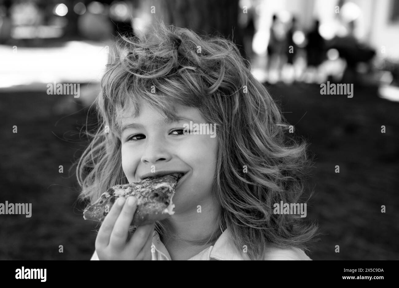 Kids eating pizza Black and White Stock Photos & Images - Alamy