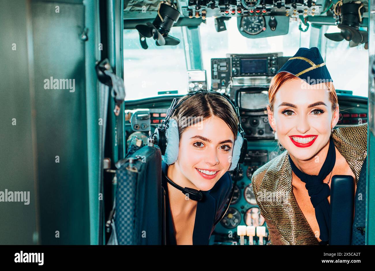 Woman pilot in aviation headsets. Pretty Stewardess. Portrait of ...