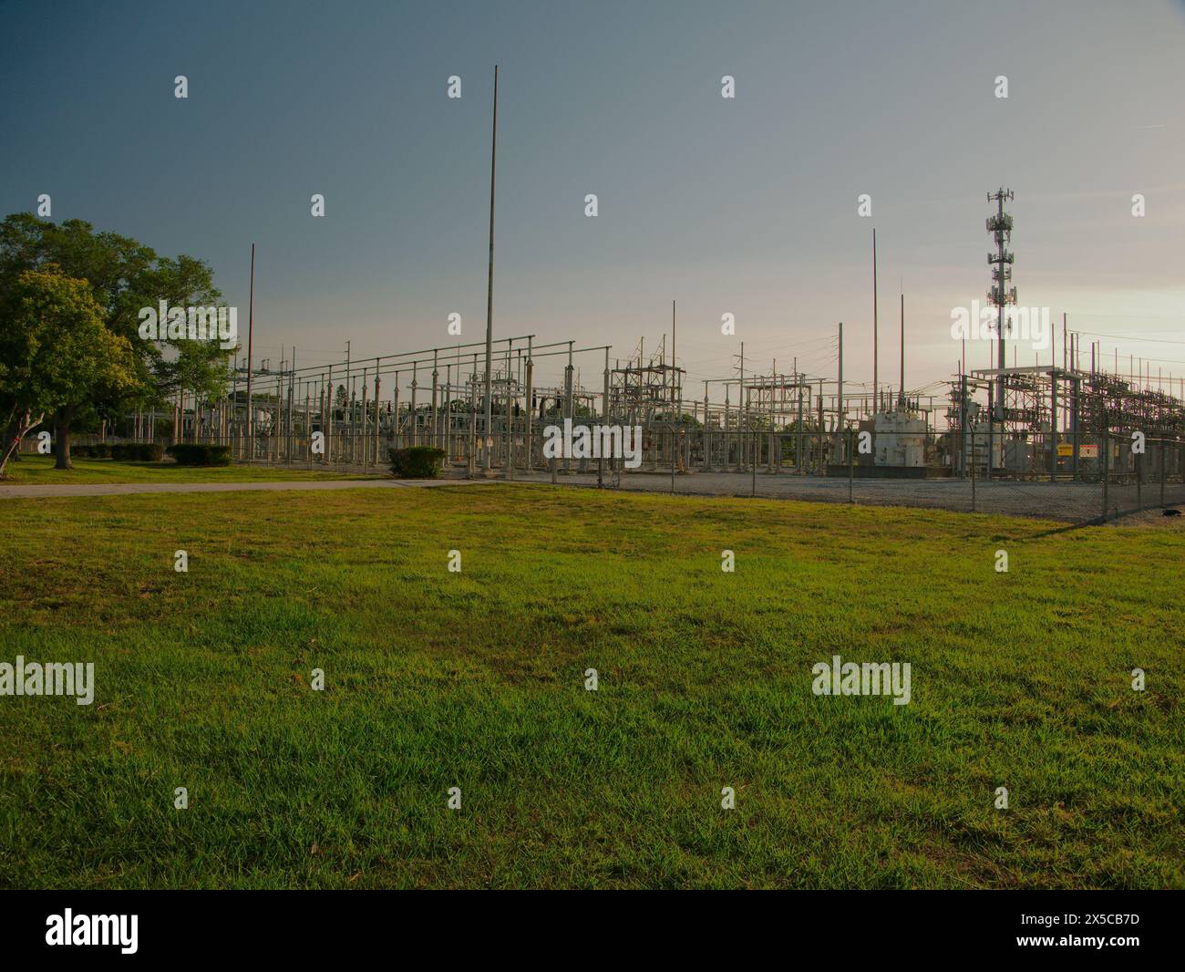 Wide view near sunset of Electric Substation with High Power Lines in ...