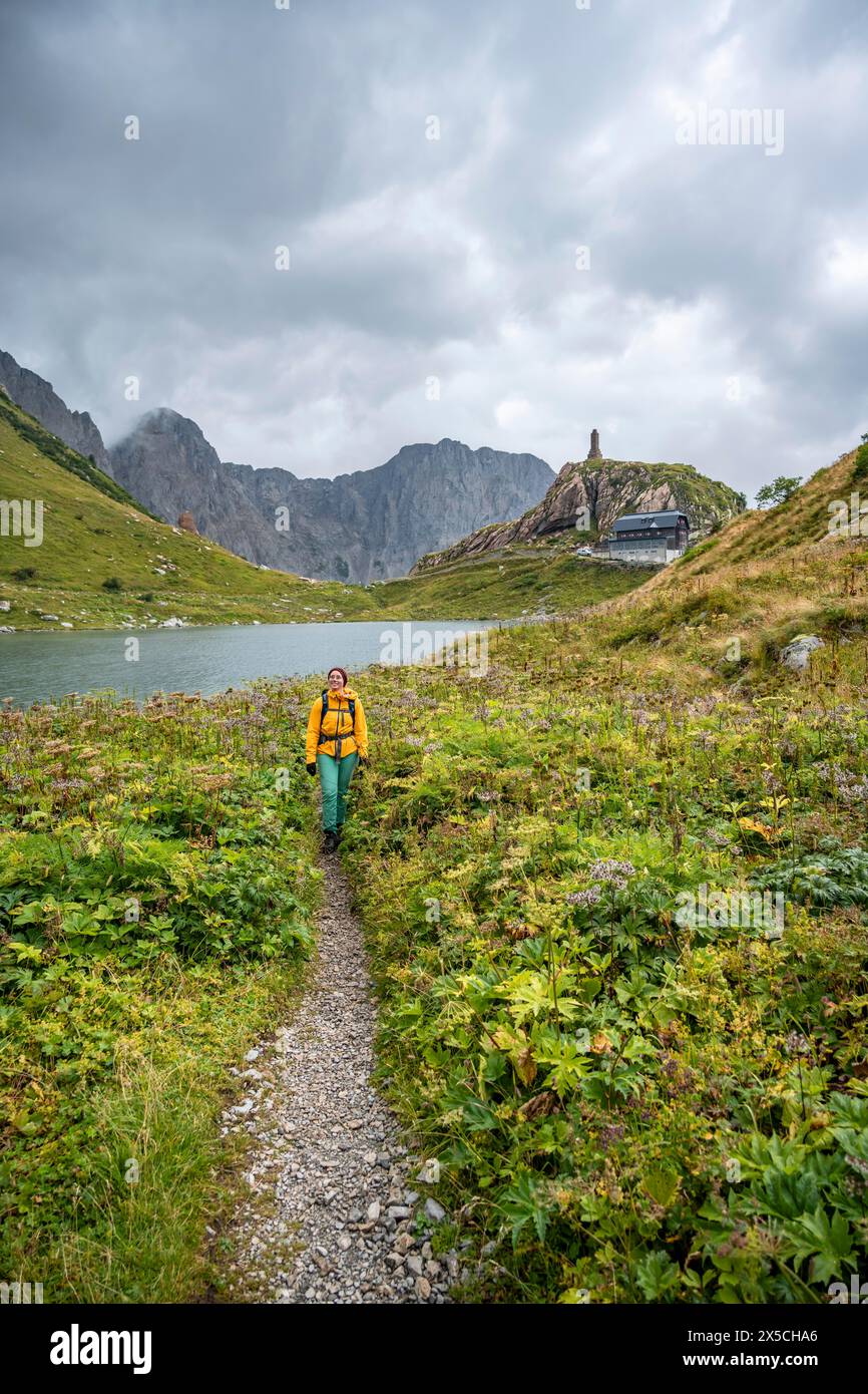 Wolayersee and Wolayerseehuette, hiker on the Carnic High Trail, Carnic ...