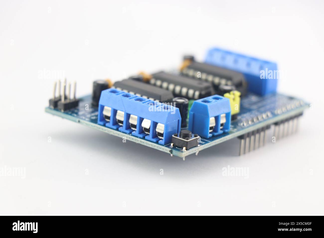 Motor driver or servo shield with a close up view of connection pins on ...