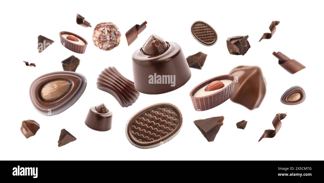 Set of different flying chocolate candies on white background Stock ...