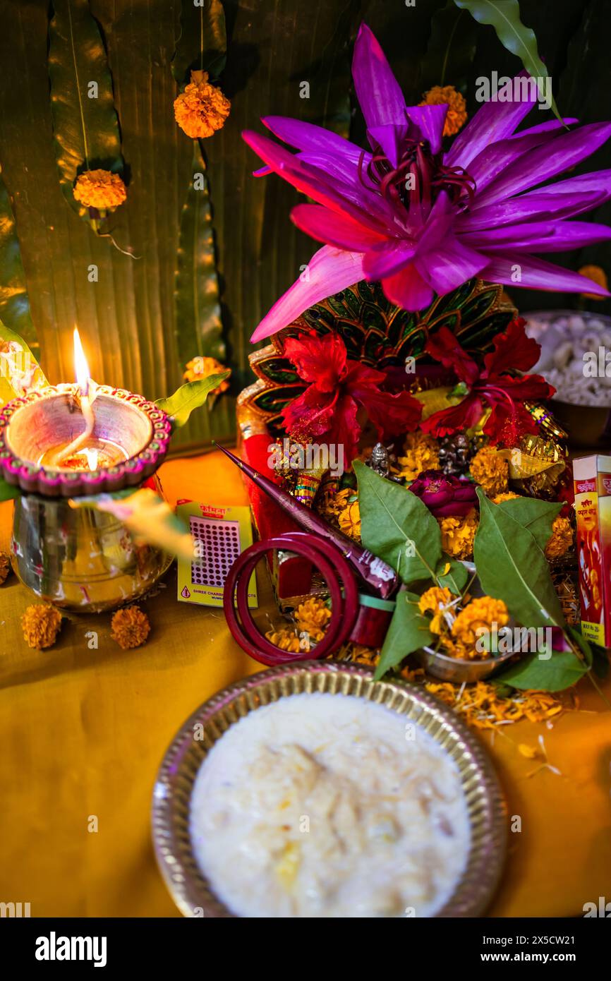 holy hindu god worship with flowers at durga pooja festival at night ...