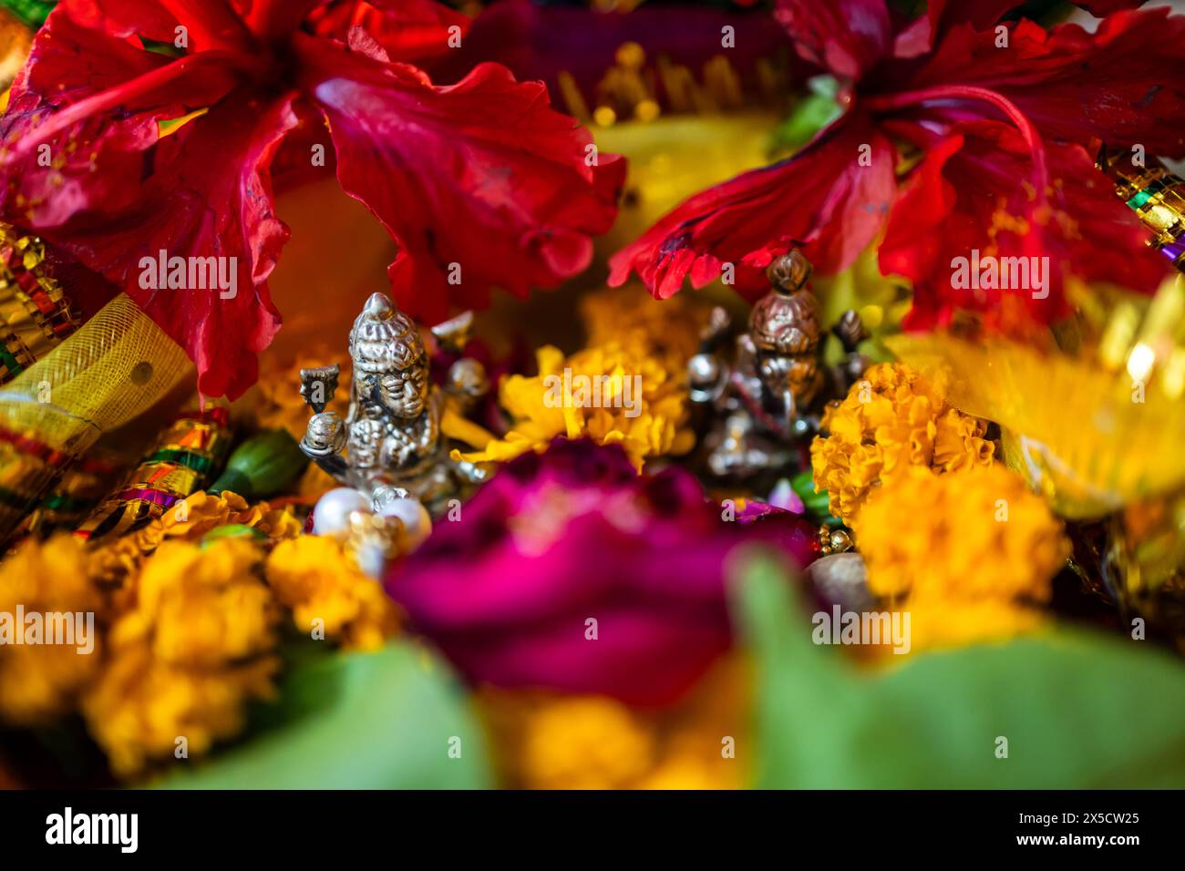 holy hindu god worship with flowers at durga pooja festival at night ...