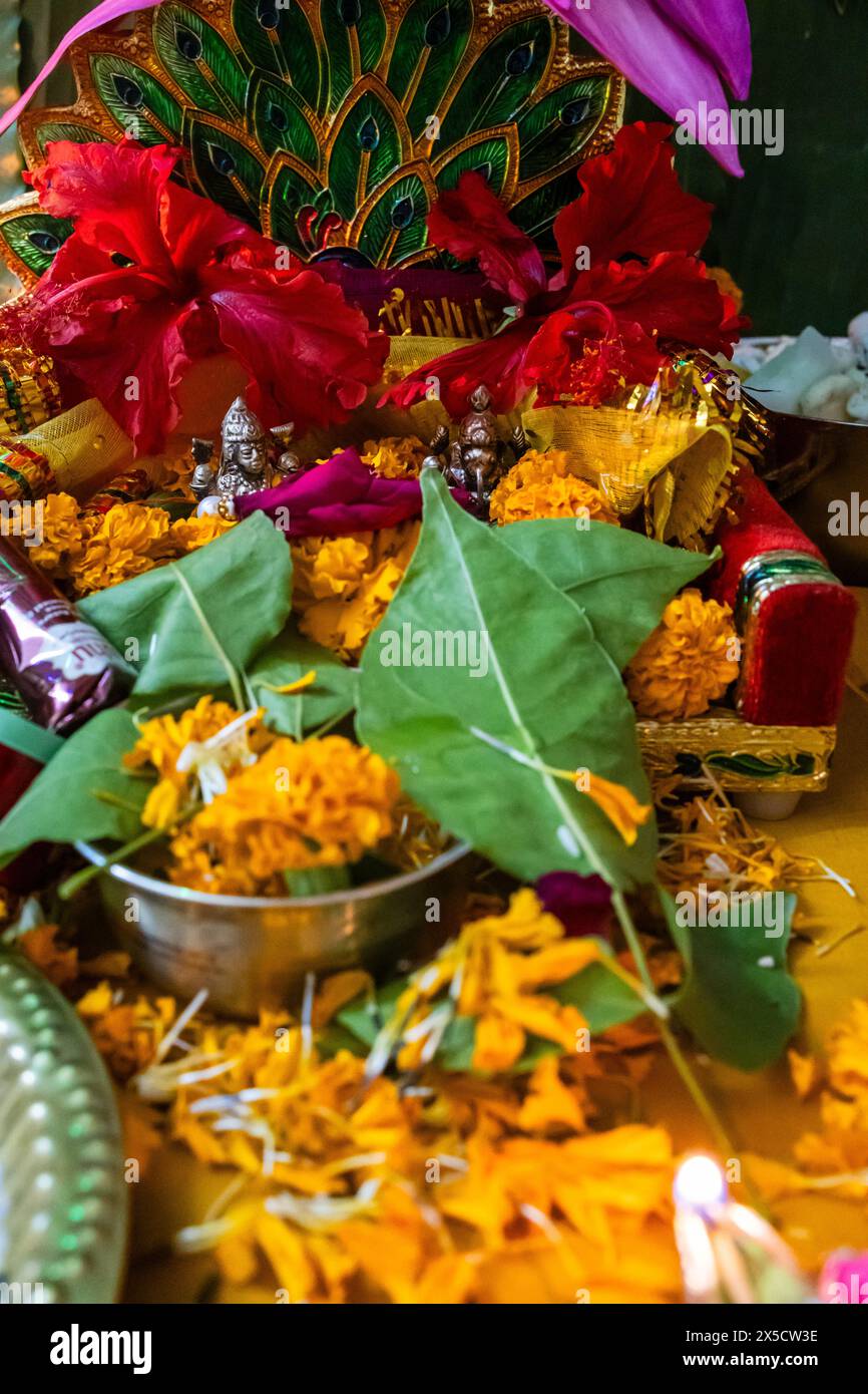 holy hindu god worship with flowers at durga pooja festival at night ...