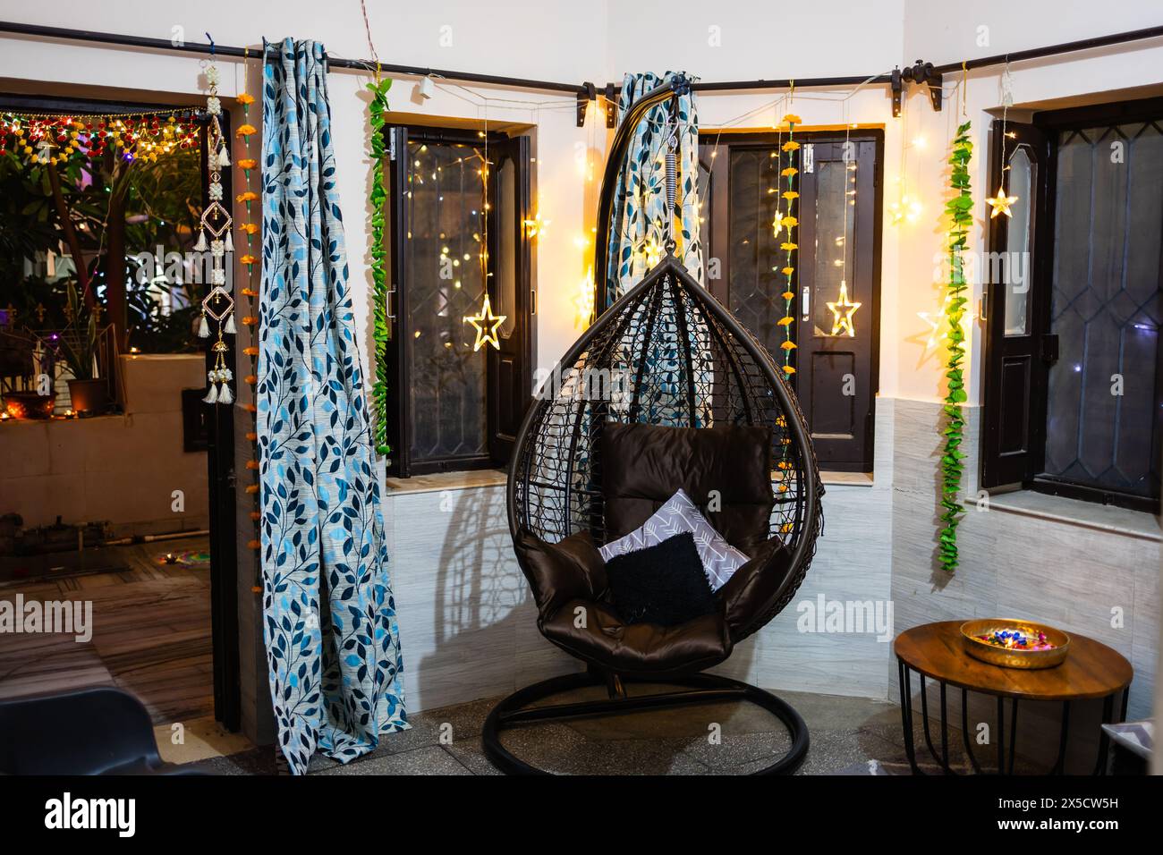 inside view of decorated house with iron swing and ferry light on the ...
