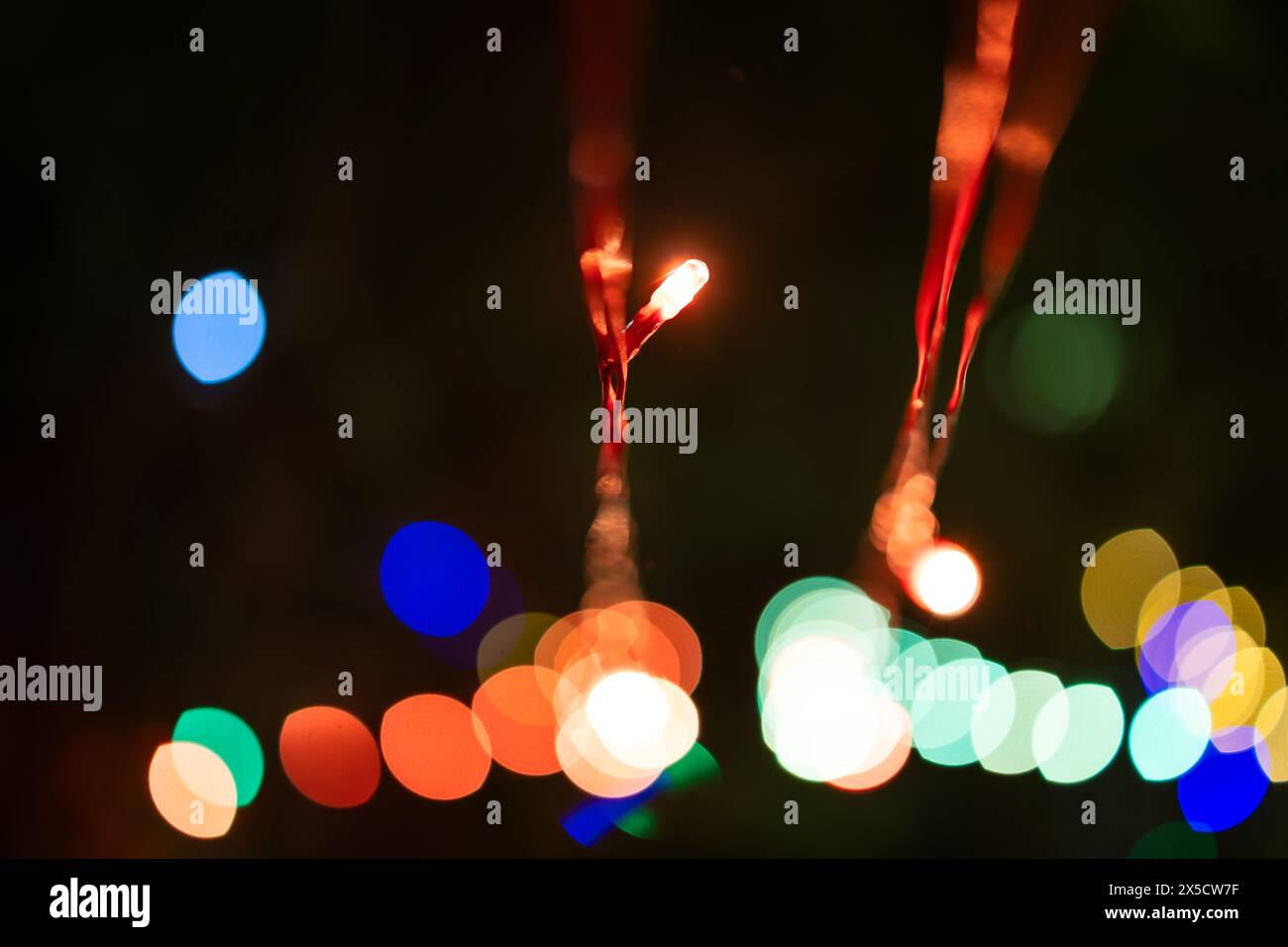 blurred bokeh effect of city ferry light at night from different angle ...