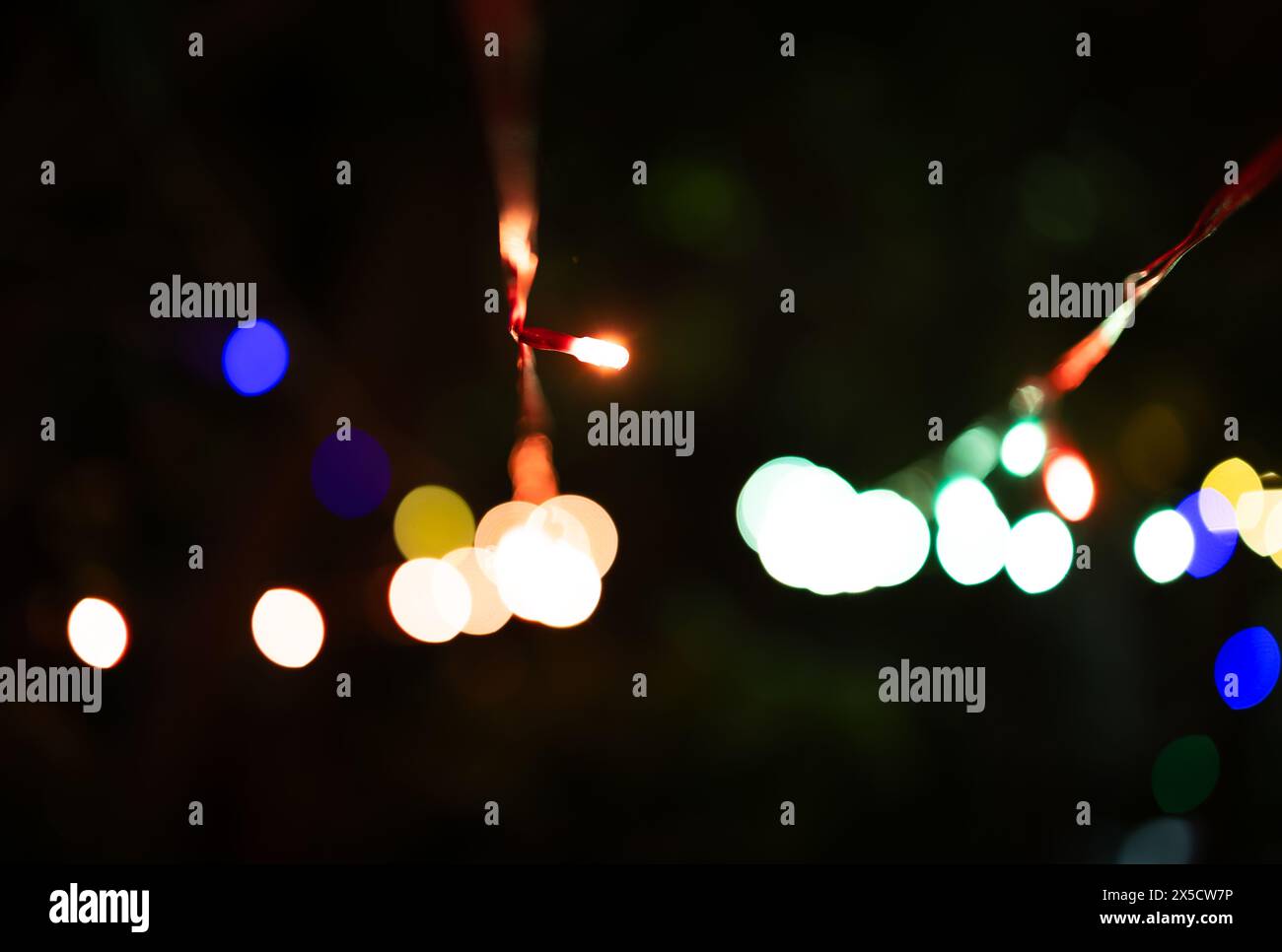 blurred bokeh effect of city ferry light at night from different angle ...
