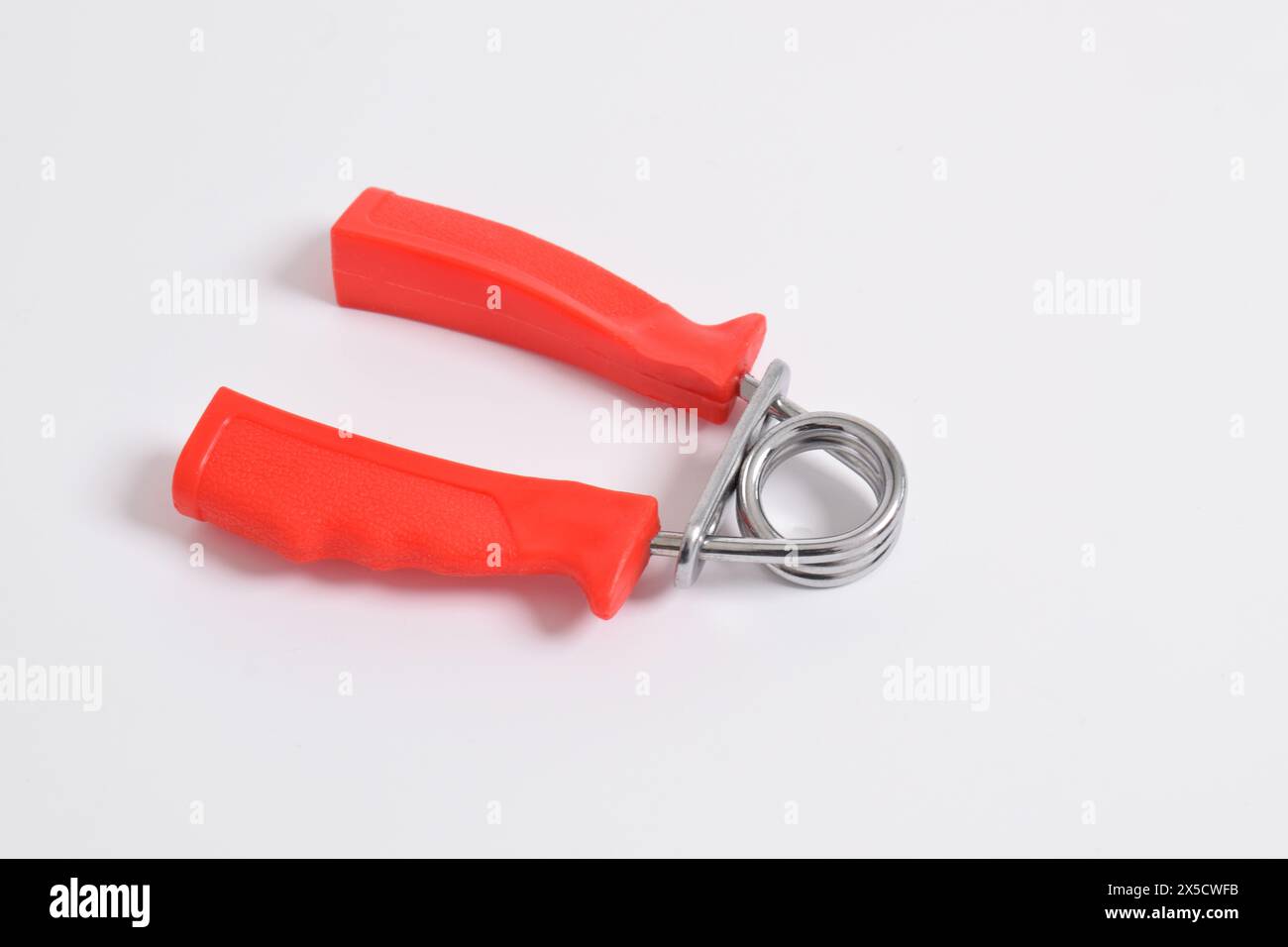 Red Handgrip isolated on white background. Hand grip exercise equipment ...