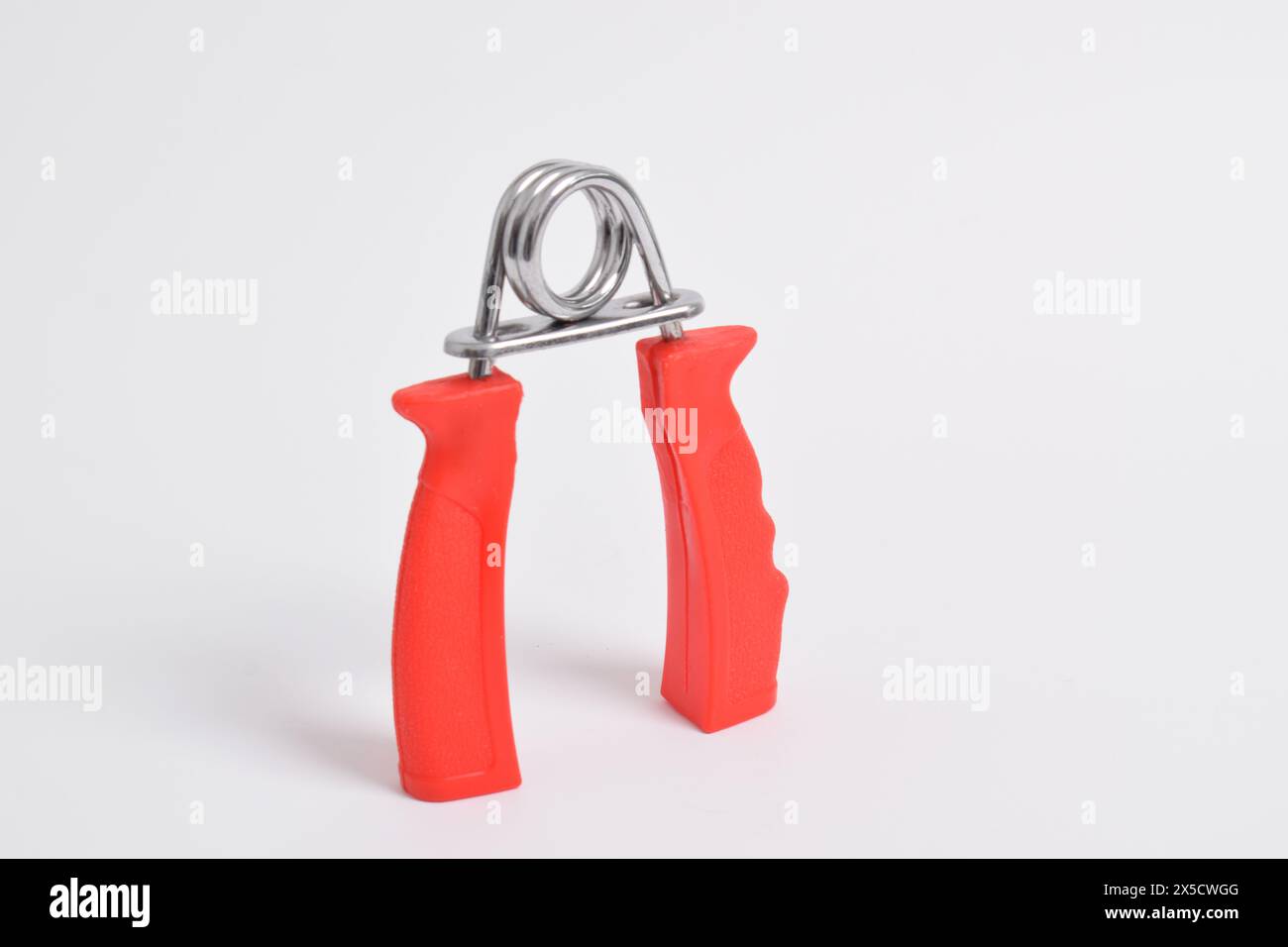 Red Handgrip isolated on white background. Hand grip exercise equipment ...