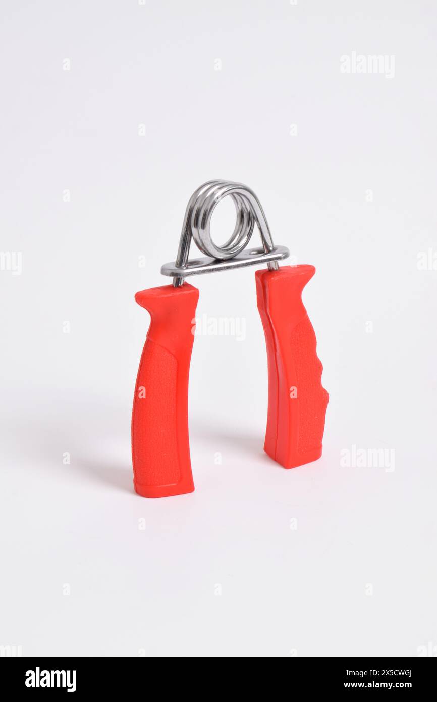 Red Handgrip isolated on white background. Hand grip exercise equipment ...
