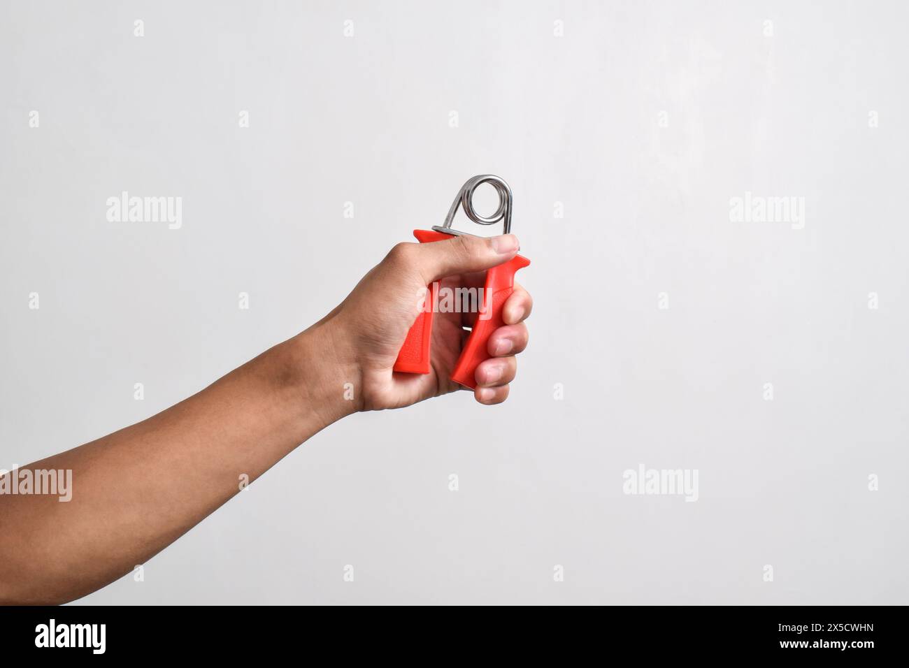 Finger-Hand exerciser has handgrip for exercise isolated on white ...