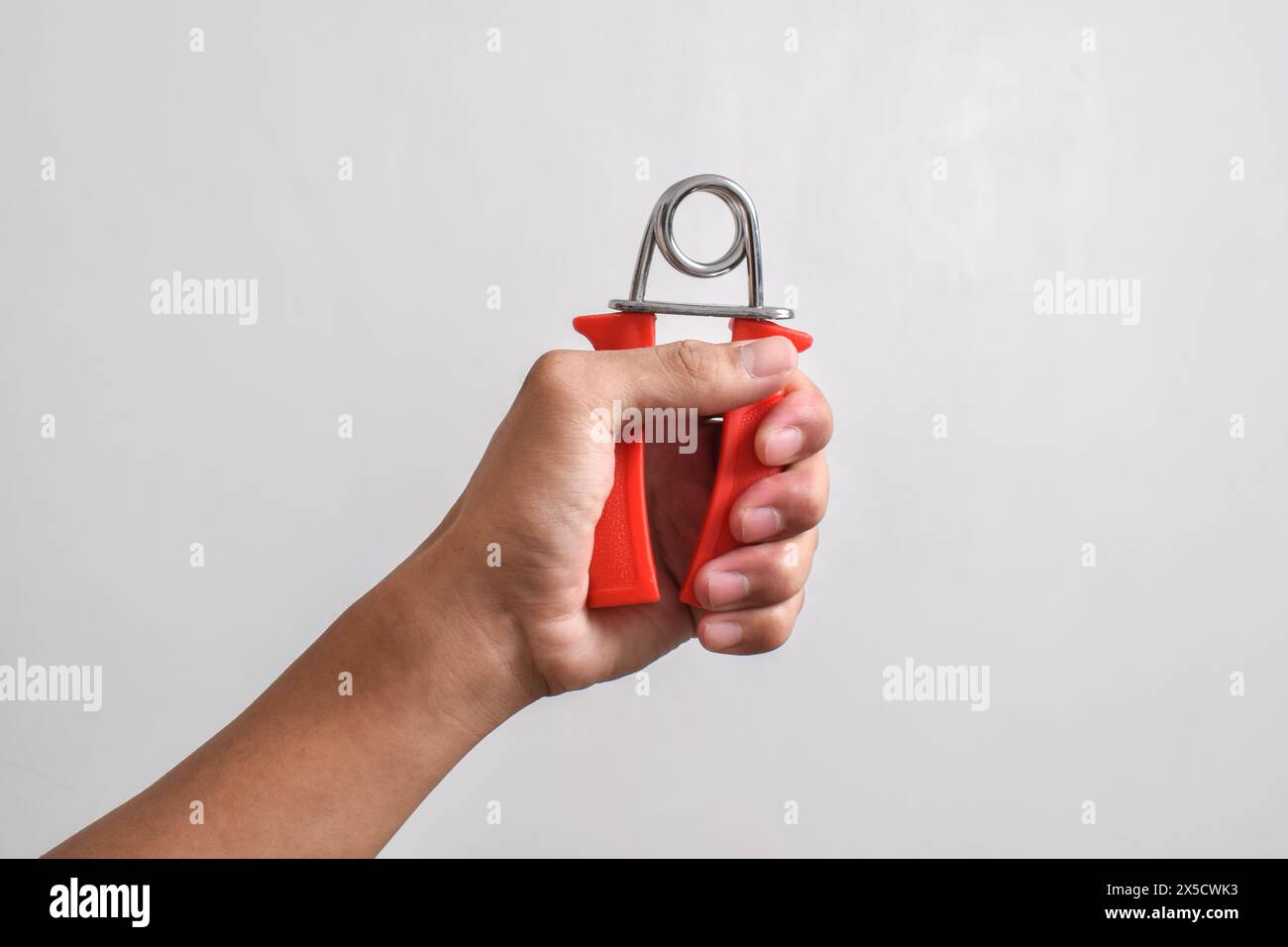 Finger-Hand exerciser has handgrip for exercise isolated on white ...