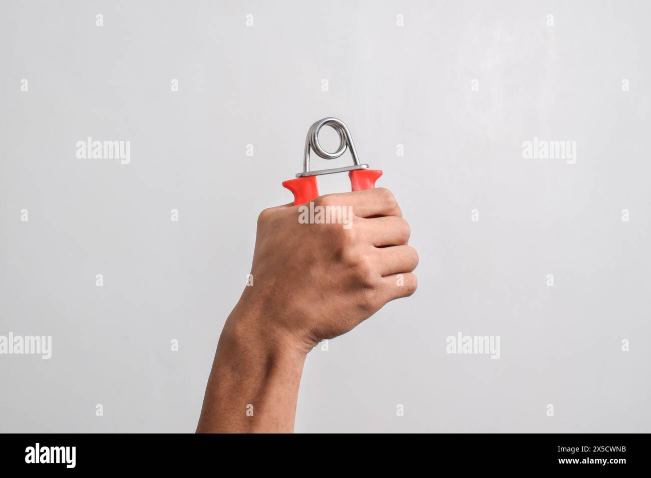 Finger-Hand exerciser has handgrip for exercise isolated on white ...