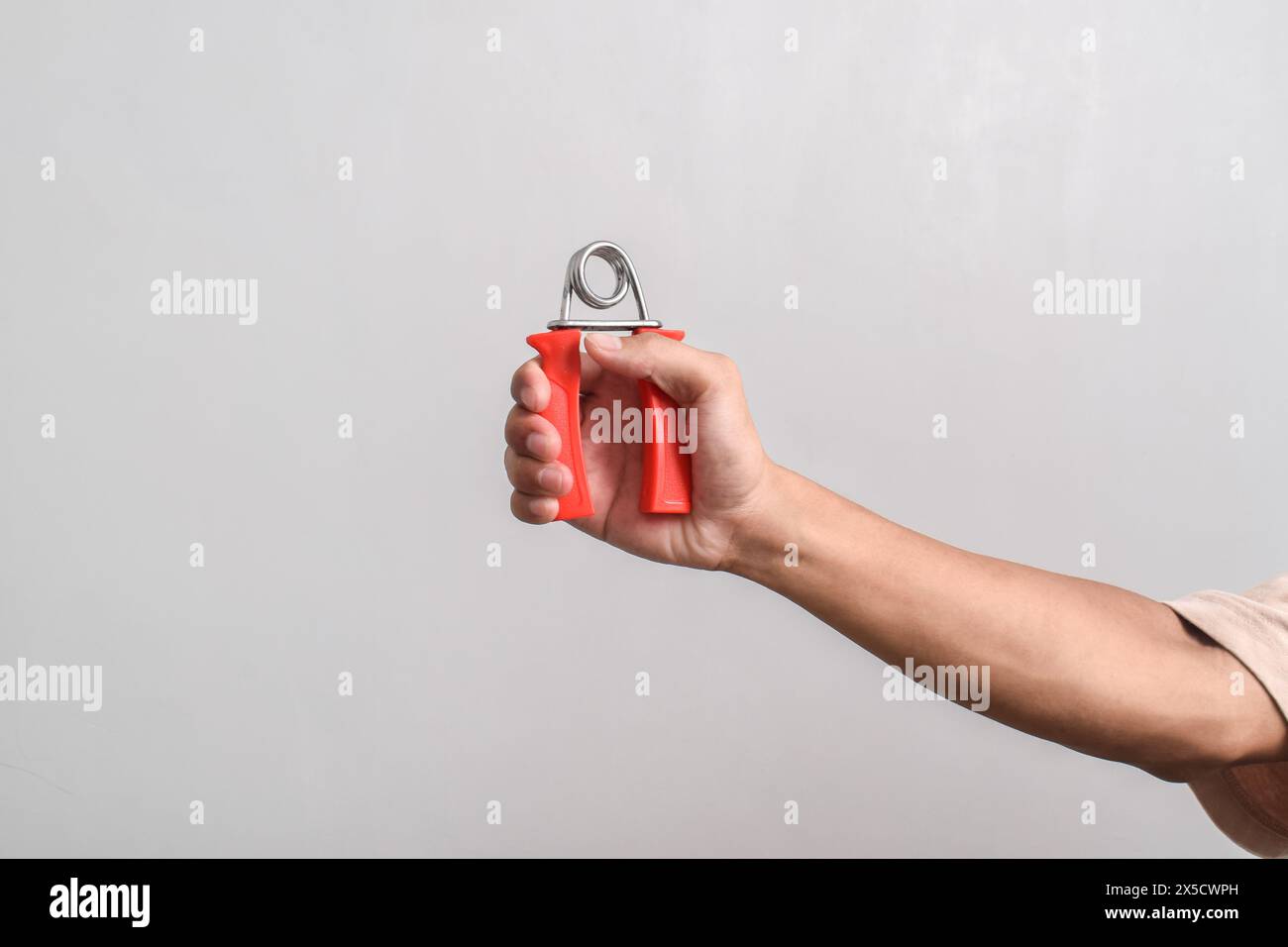 Finger-Hand exerciser has handgrip for exercise isolated on white ...