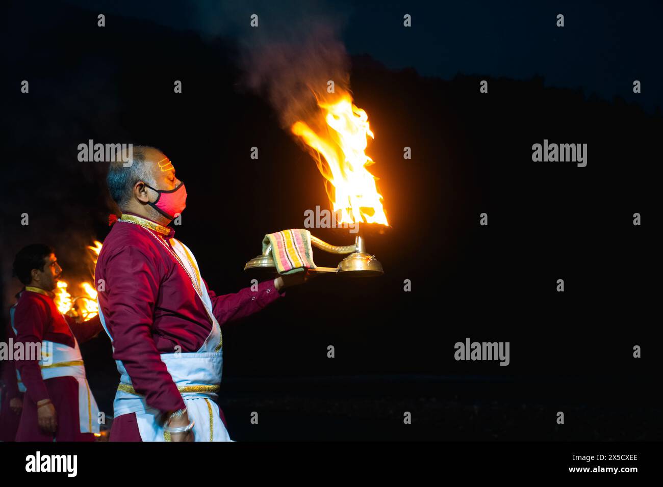 Ganga Aarti Ceremony at Triveni ghat in Rishikesh Stock Photo - Alamy