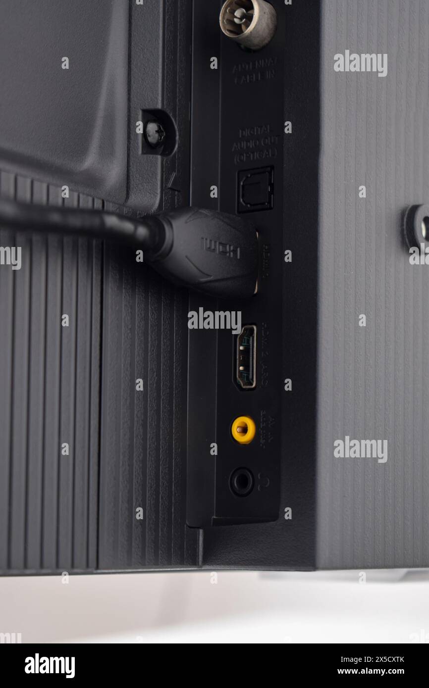 Protected hdmi cable connected to the monitor. The HDMI cable is ...