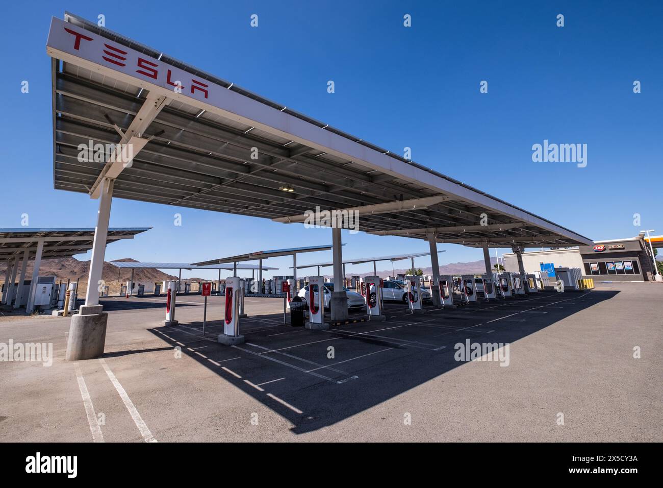 A large collection of Tesla Superchargers in action along Interstate 15 ...