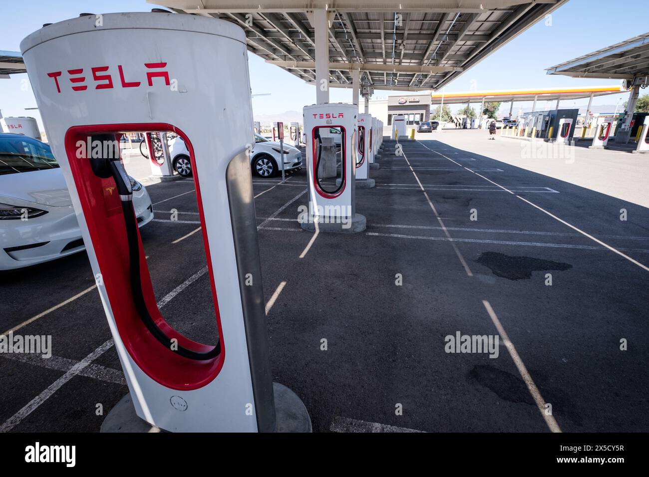 A large collection of Tesla Superchargers in action along Interstate 15 ...