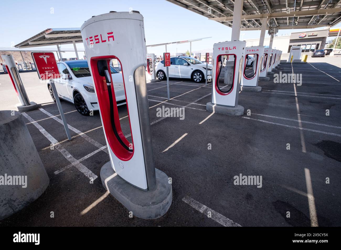 A large collection of Tesla Superchargers in action along Interstate 15 ...