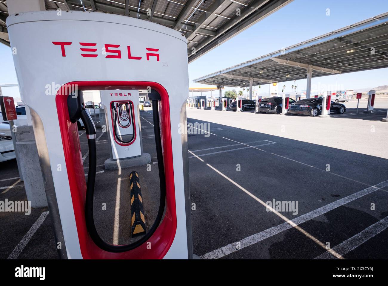 A large collection of Tesla Superchargers in action along Interstate 15 ...