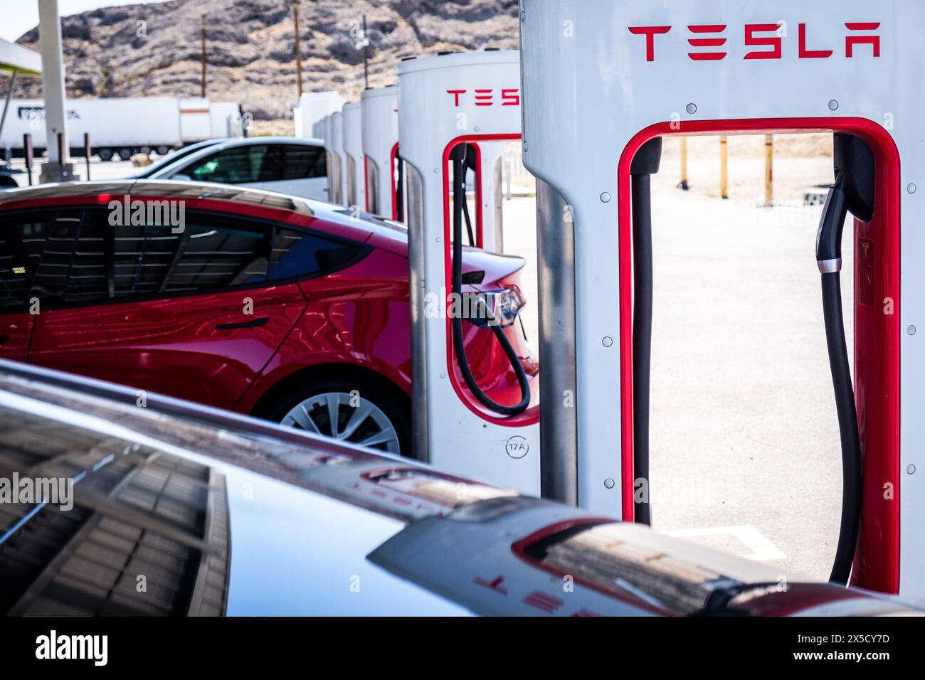 A large collection of Tesla Superchargers in action along Interstate 15 ...