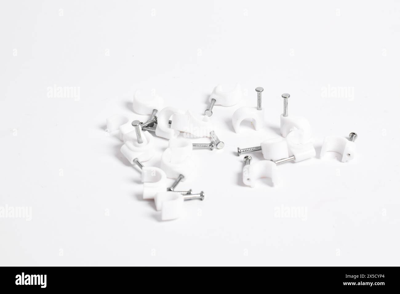 Cable nail clip, Plastic cable clips with steel nails isolated on white ...