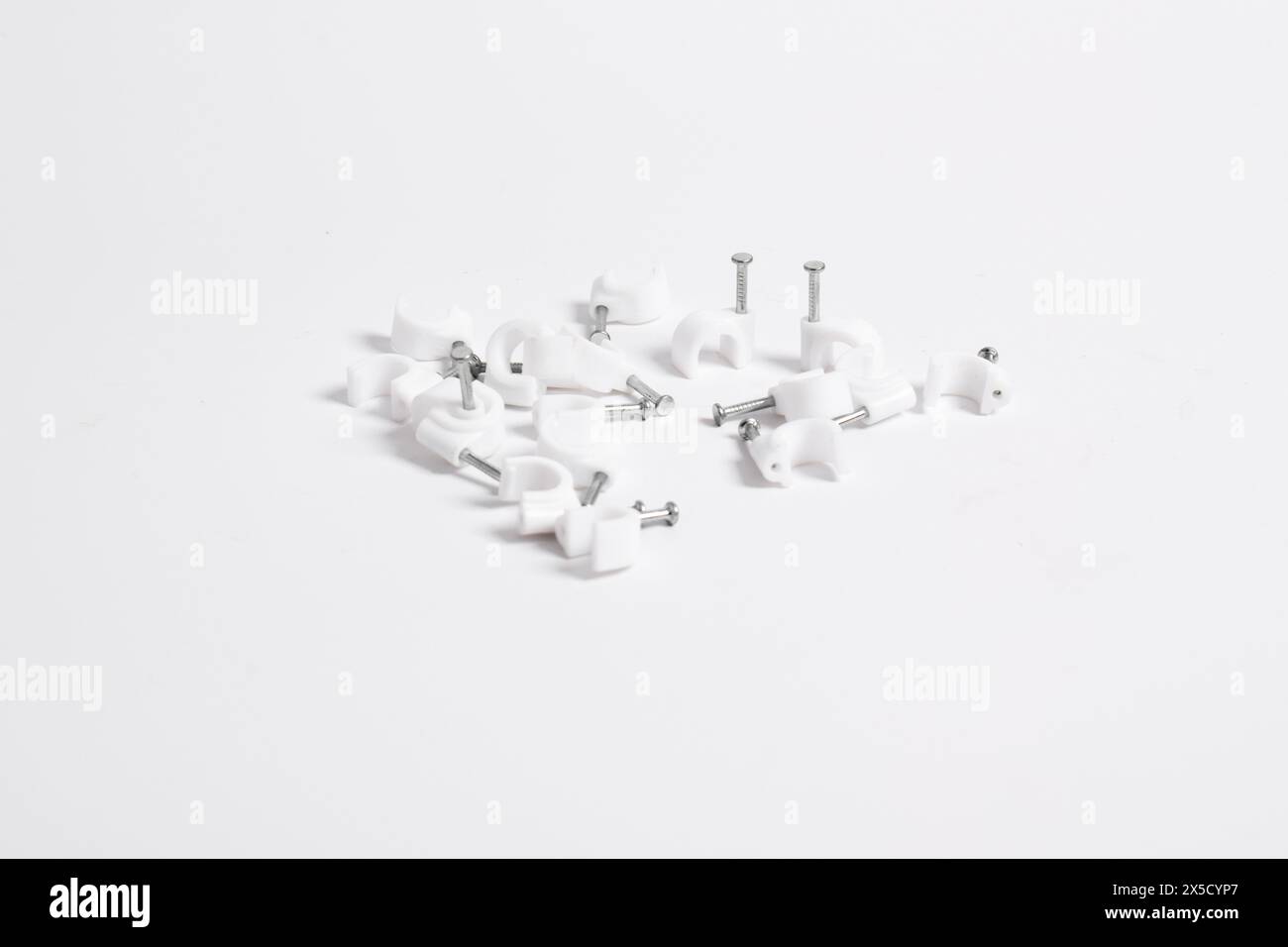 Cable nail clip, Plastic cable clips with steel nails isolated on white ...