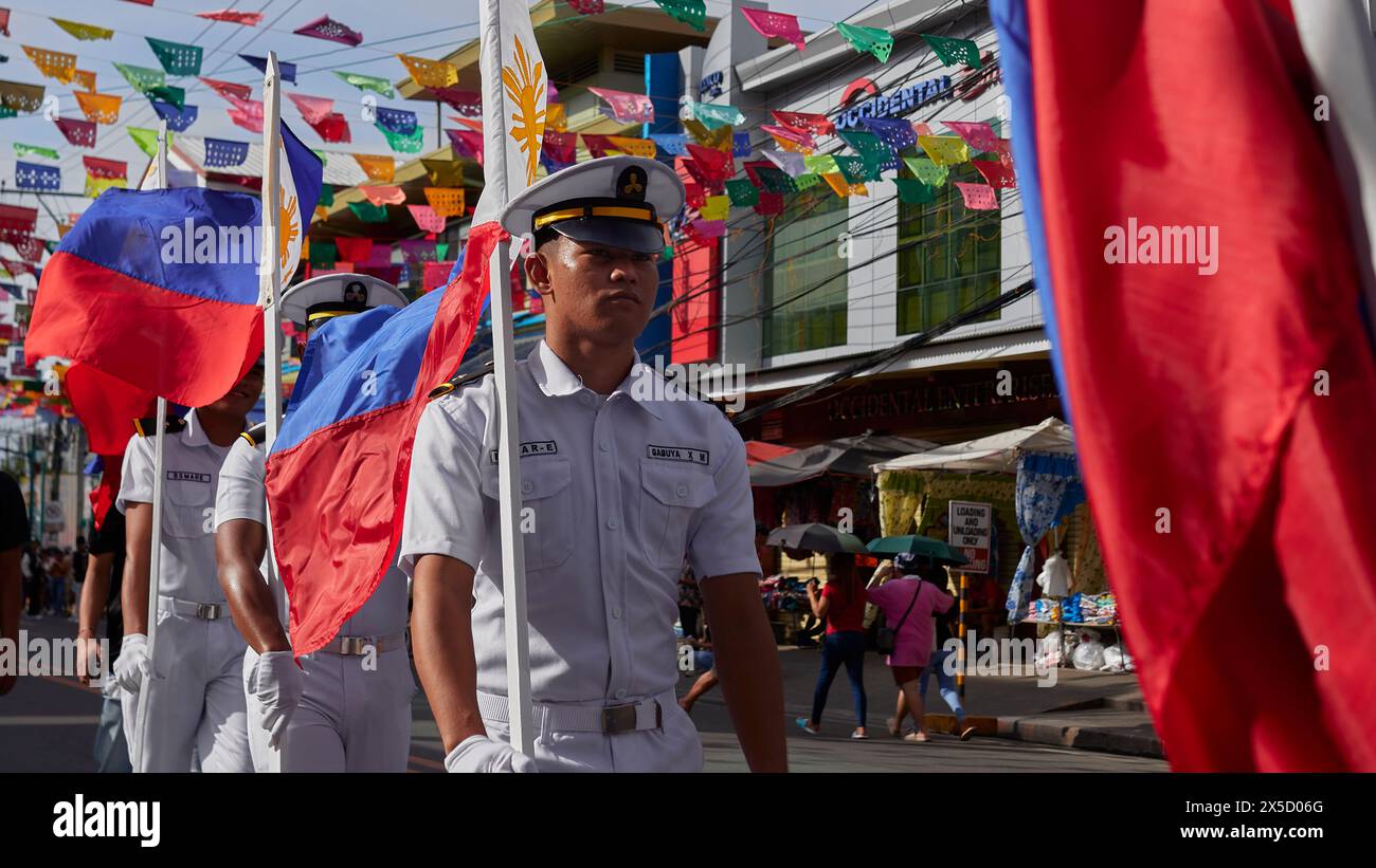 A squad of cadets, with the national flag of the Philippines, opens the ...