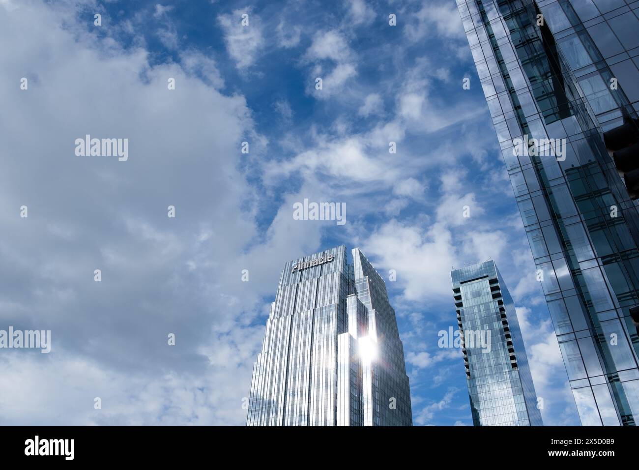 Puffy cumulous clouds and the skyline of downtown Nashville, Tennessee ...