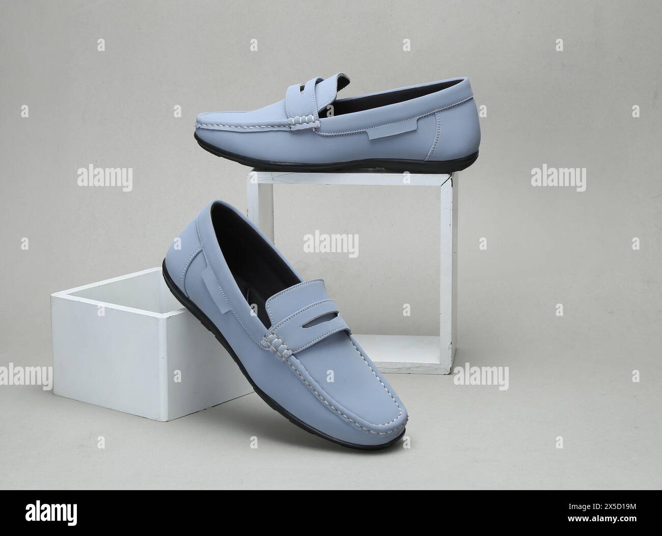 light blue leather loafers slip on shoes isolated on grey background ...