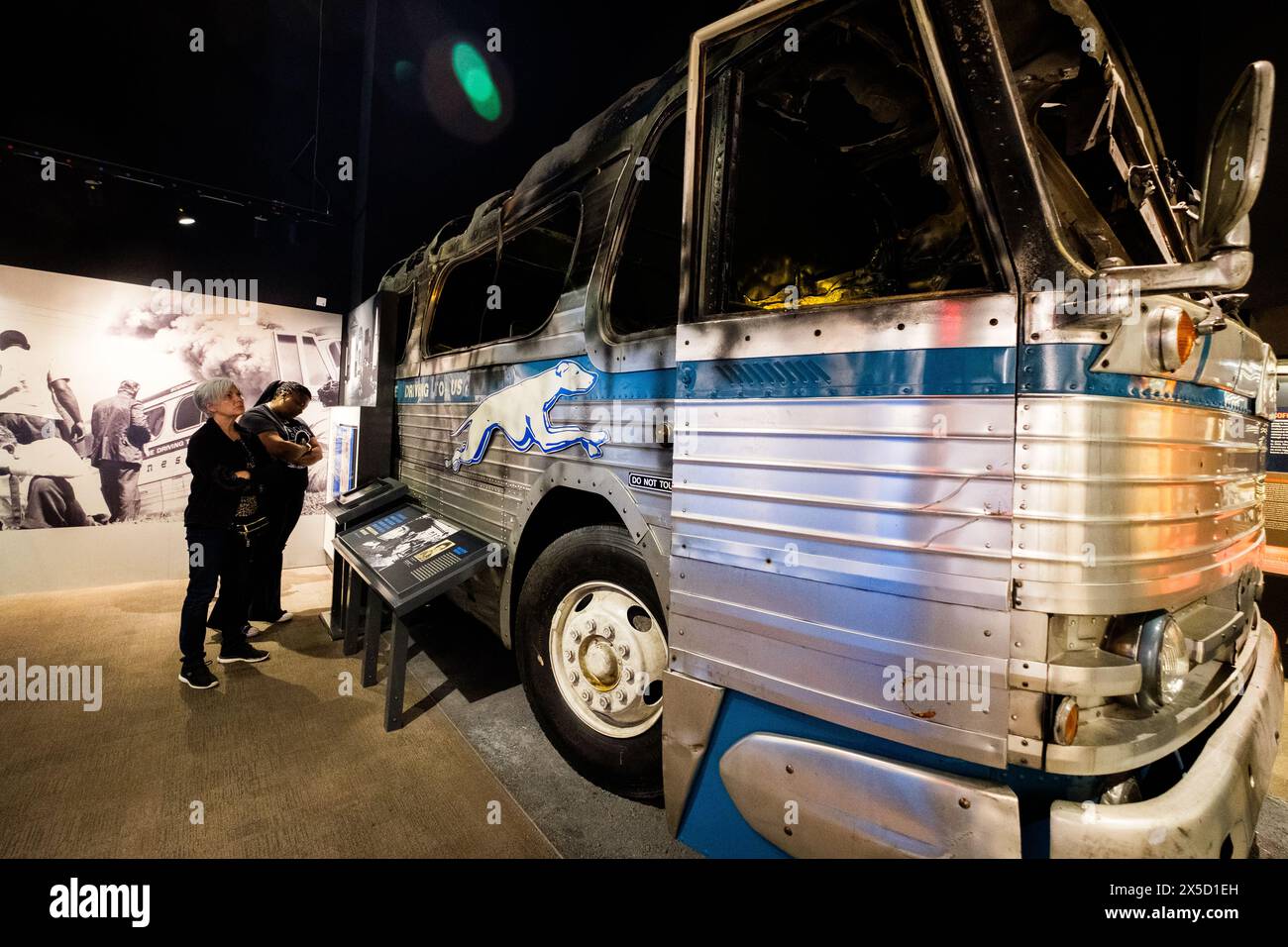 Museum goers examine burned out bus that carried Freedom Riders ...
