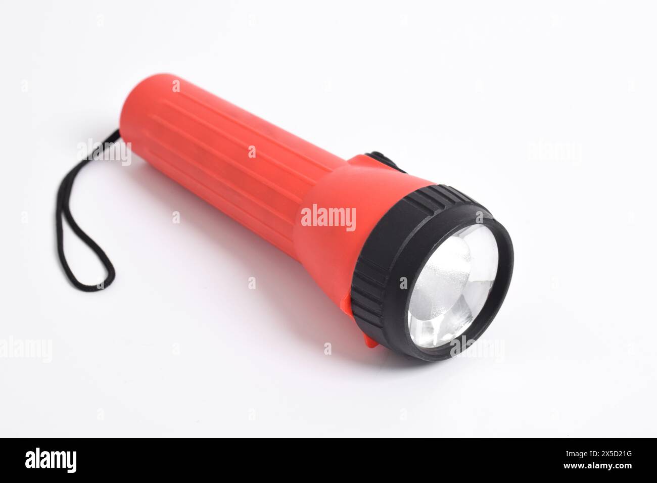 Red color flashlight isolated on white background. Battery-powered red ...