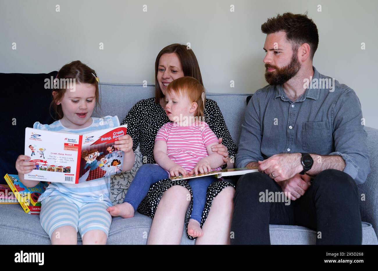 Opal Sandy (centre), who was born completely deaf because of a rare ...