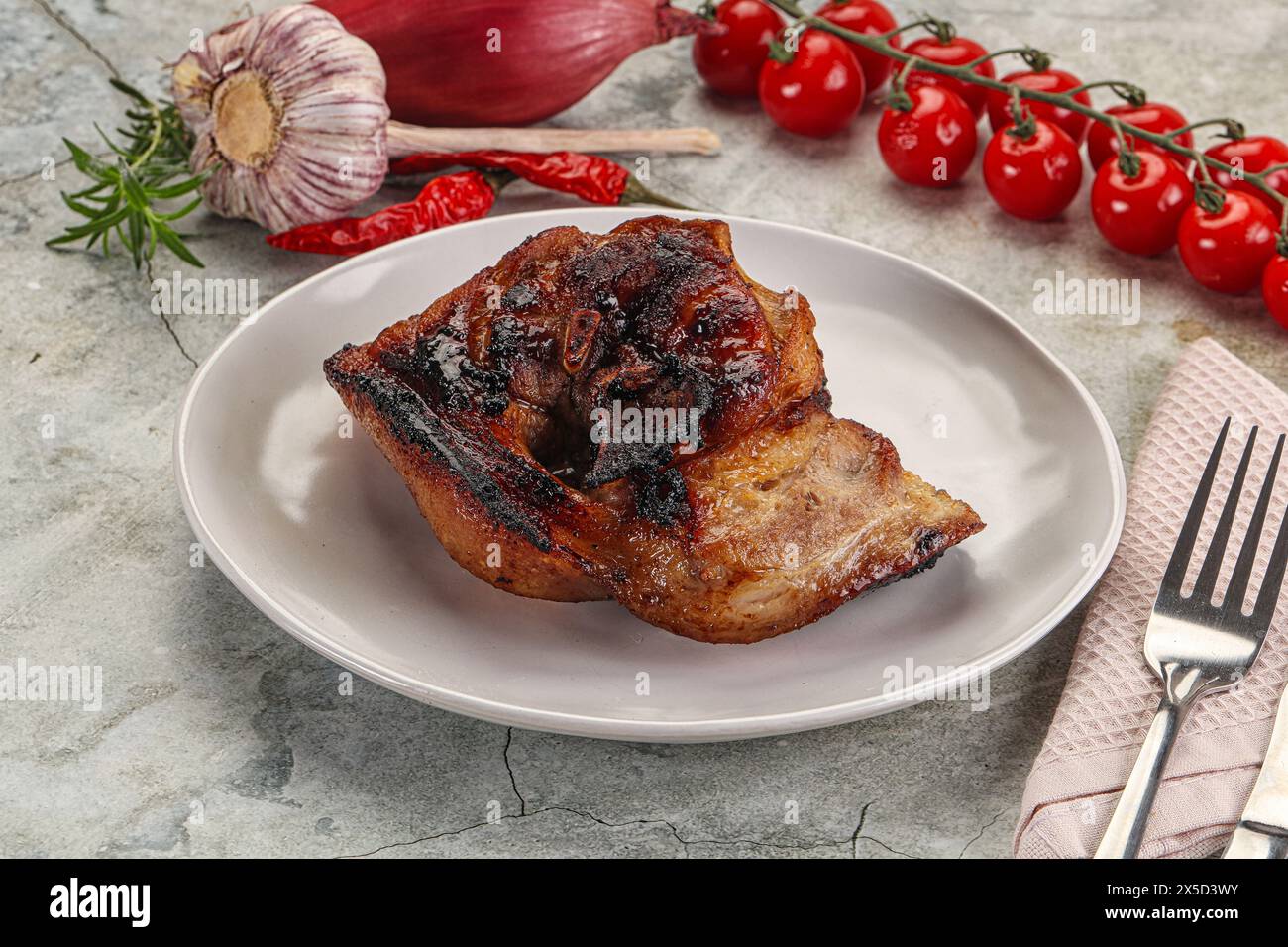Roasted pork knuckle steak with bone Stock Photo - Alamy