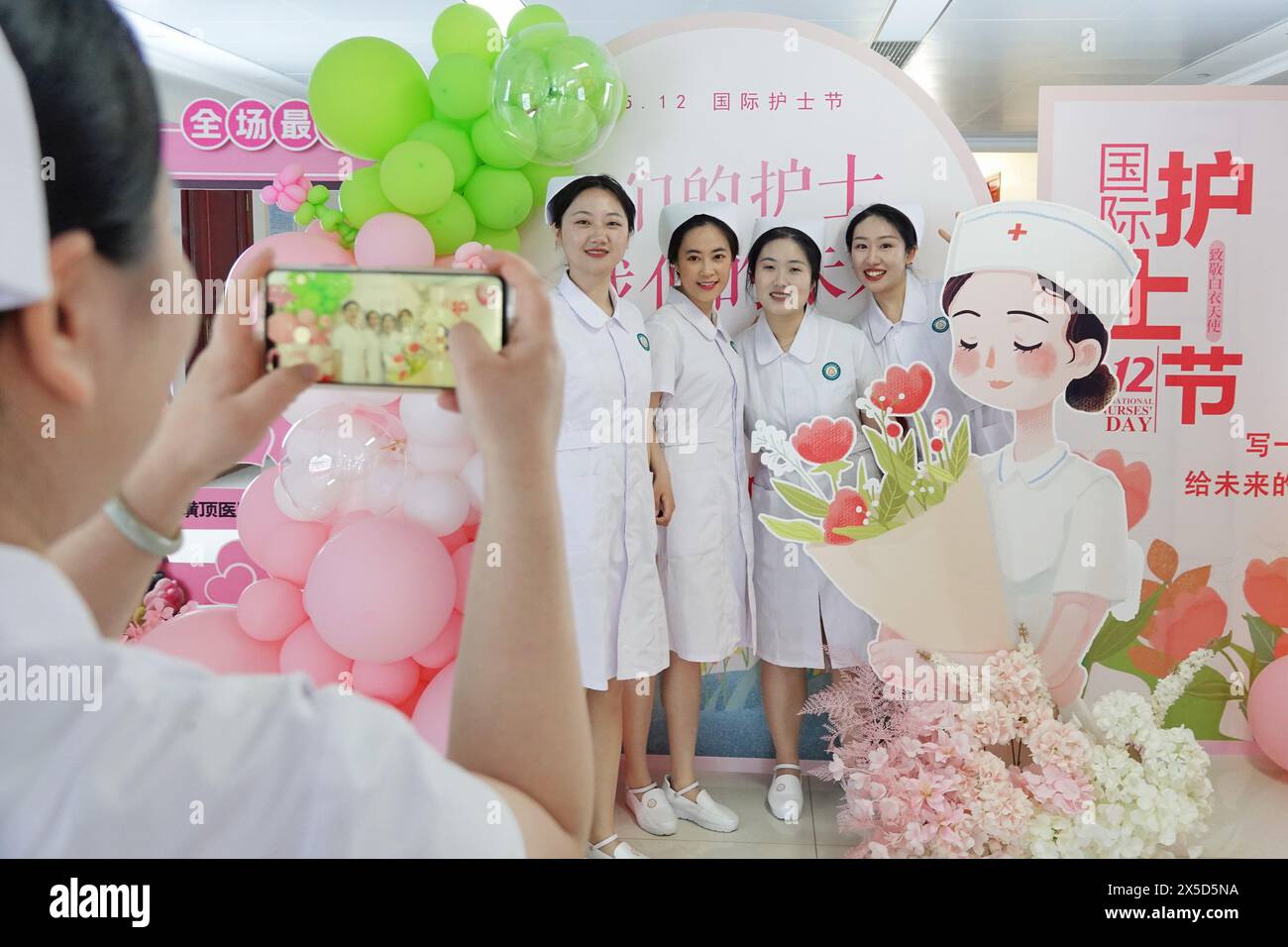 YANTAI, CHINA - MAY 9, 2024 - Nurses pose for a group photo in front of ...