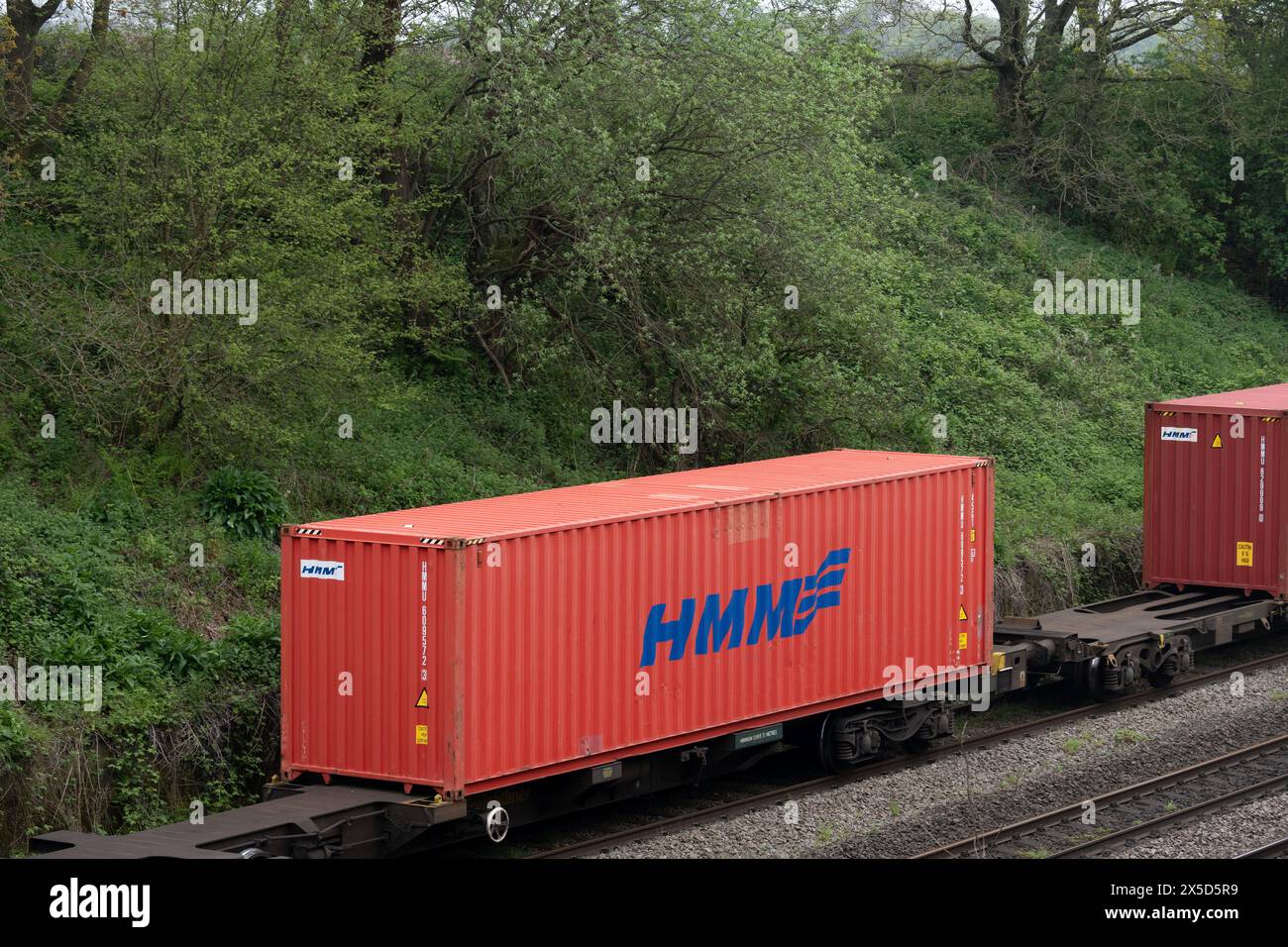 HMM shipping container on a freightliner train, Warwickshire, UK Stock ...