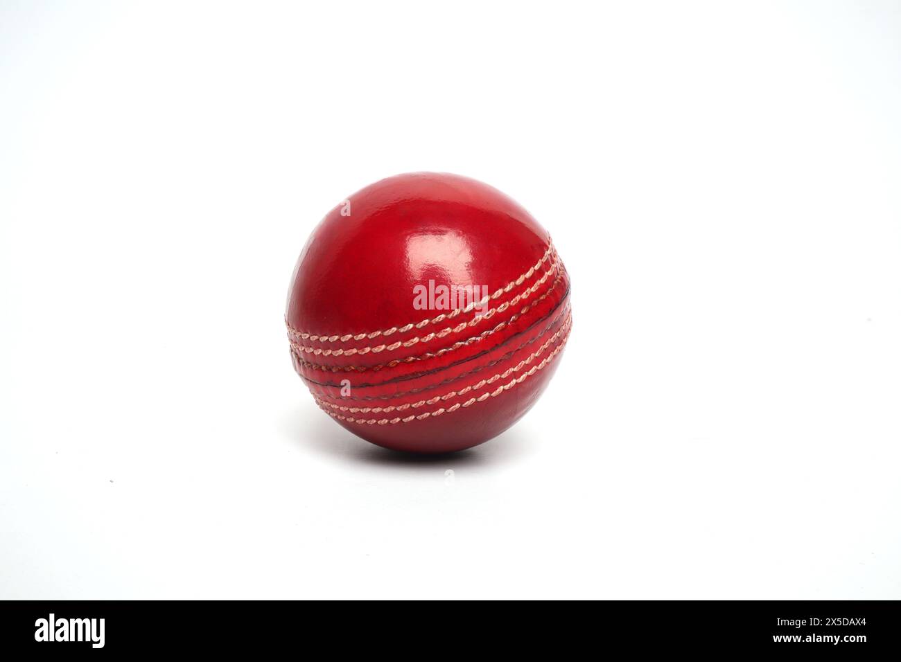 red cricket leather ball isolated Stock Photo - Alamy