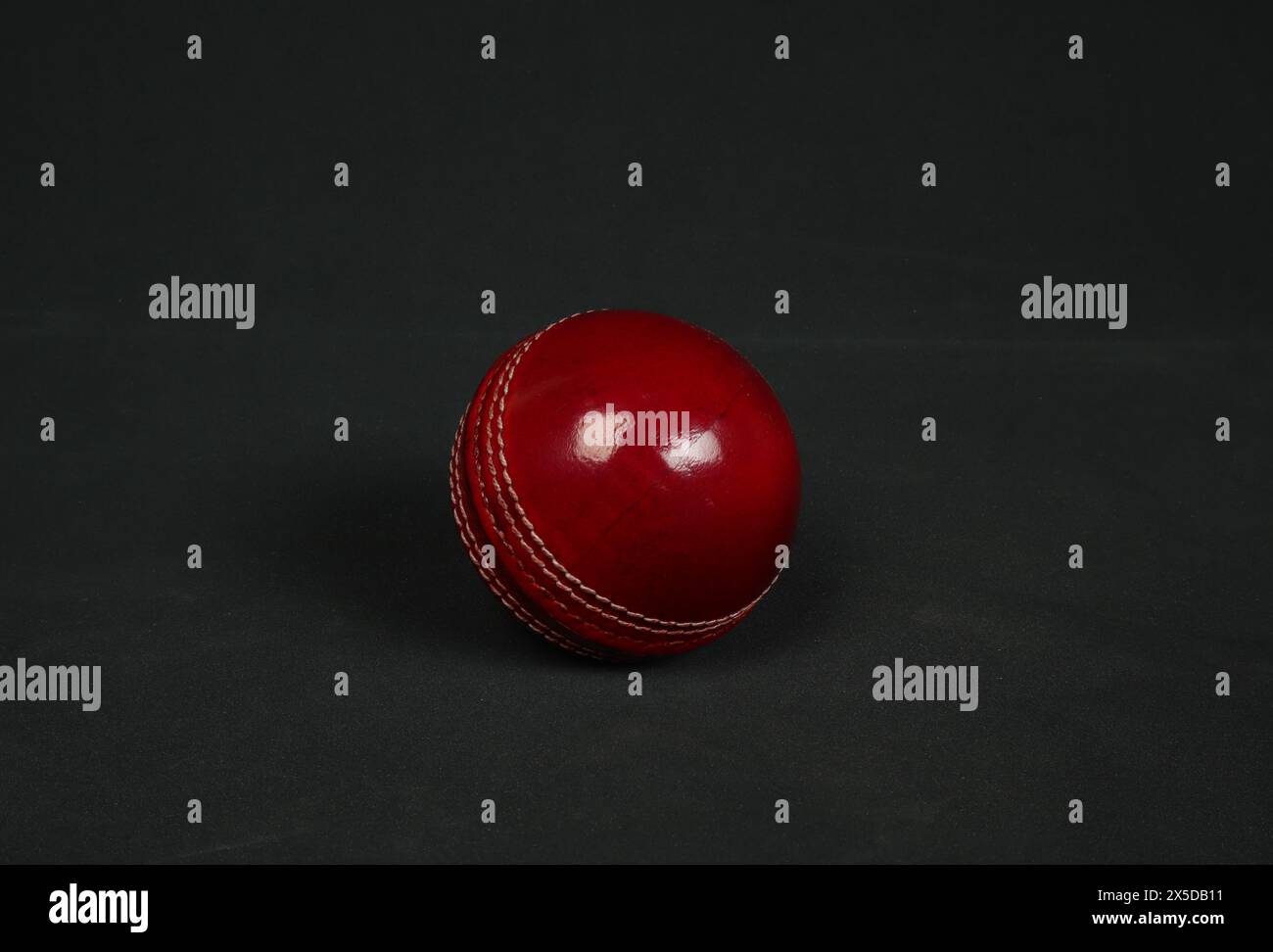 red cricket leather ball isolated Stock Photo - Alamy