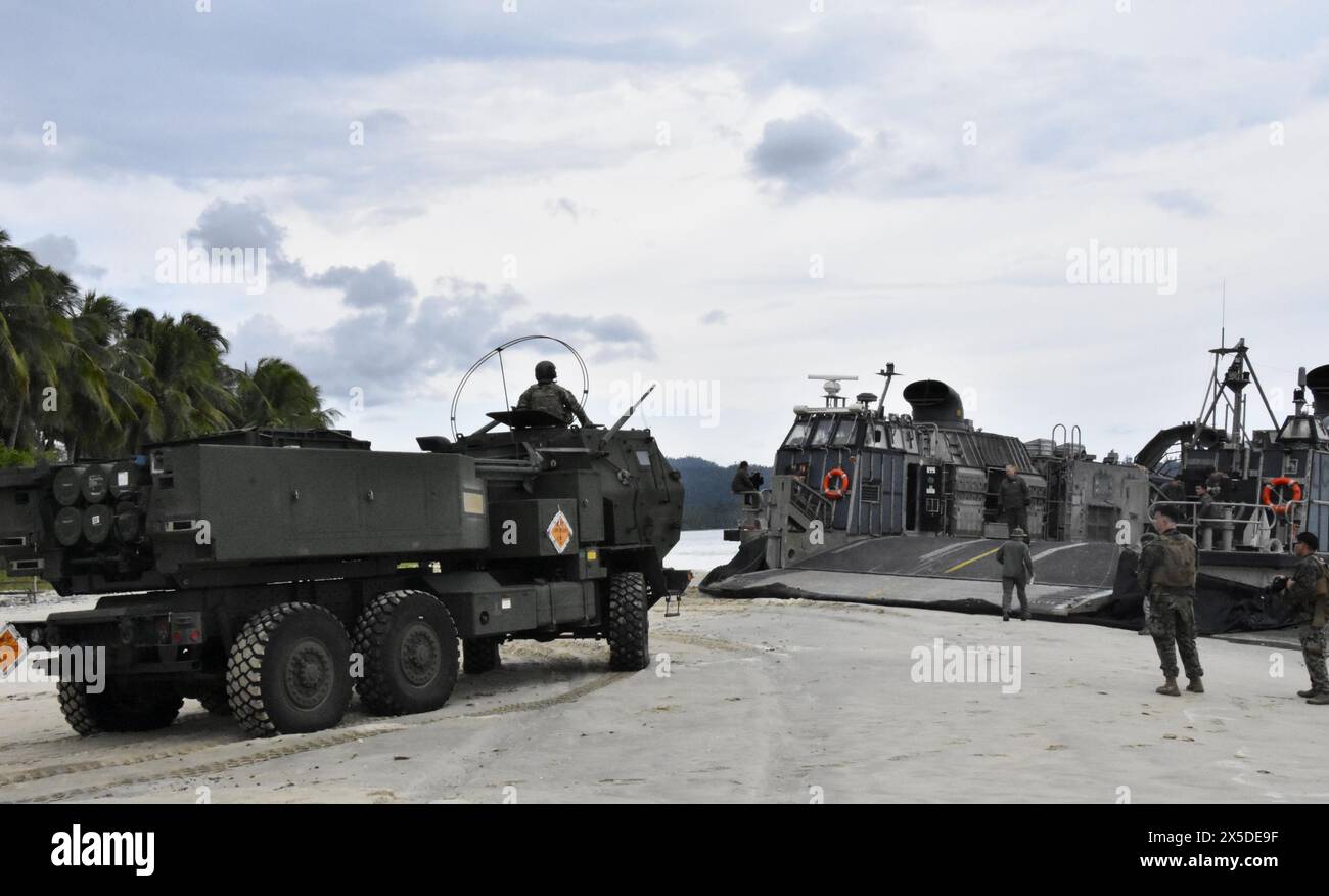 A Himars rocket launcher is transferred to a U.S. military hovercraft ...
