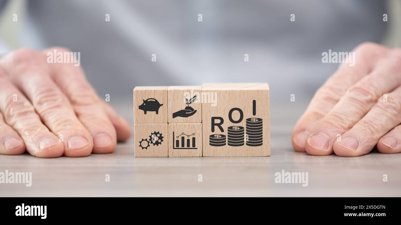 Wooden blocks with symbol of roi concept Stock Photo - Alamy