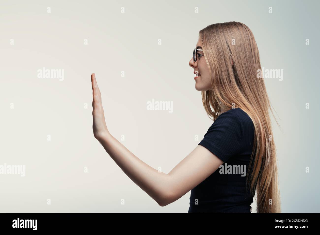 Versatile gesture from a woman, possibly a greeting, high-five, or oath ...