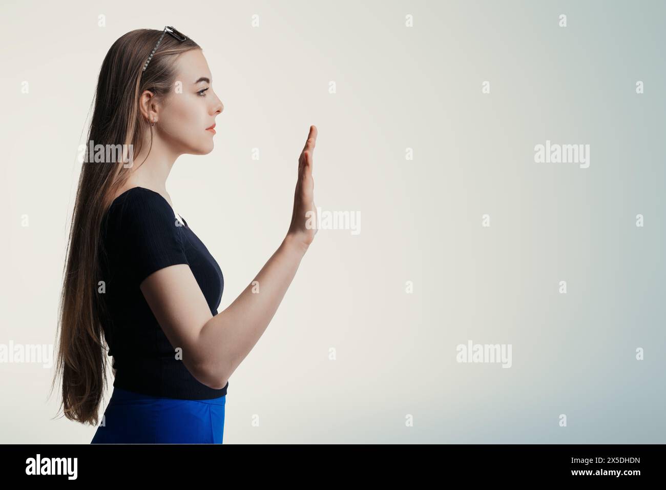 Poised for interaction, her hand welcomes a high-five, a wave hello, or ...