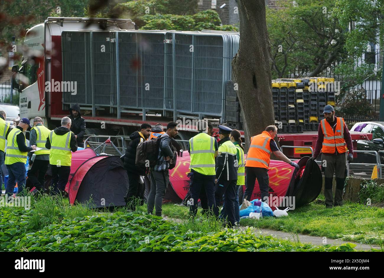 An early morning operation to remove tents which have been pitched by ...